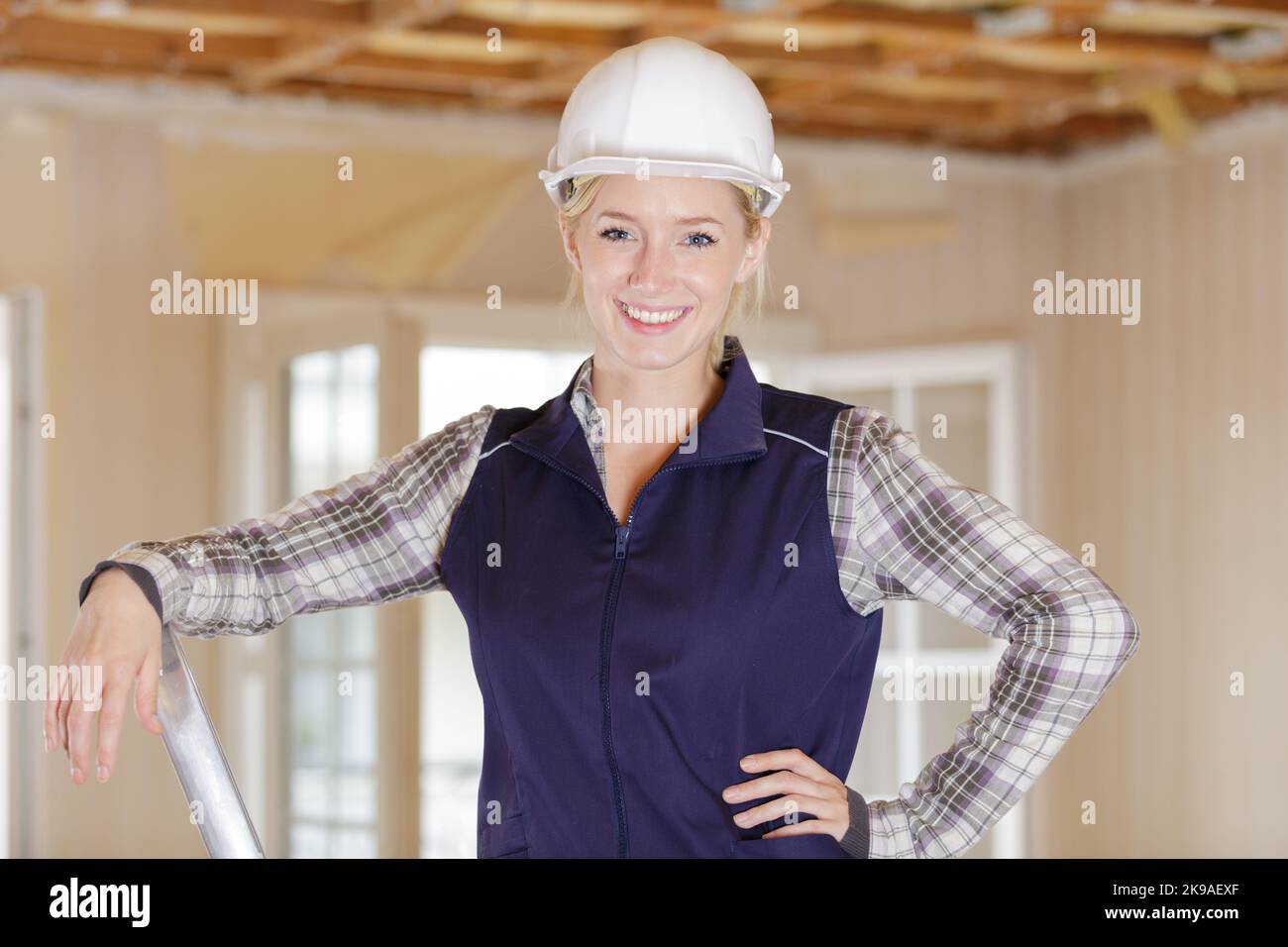 happy female builder after inspecting building Stock Photo - Alamy