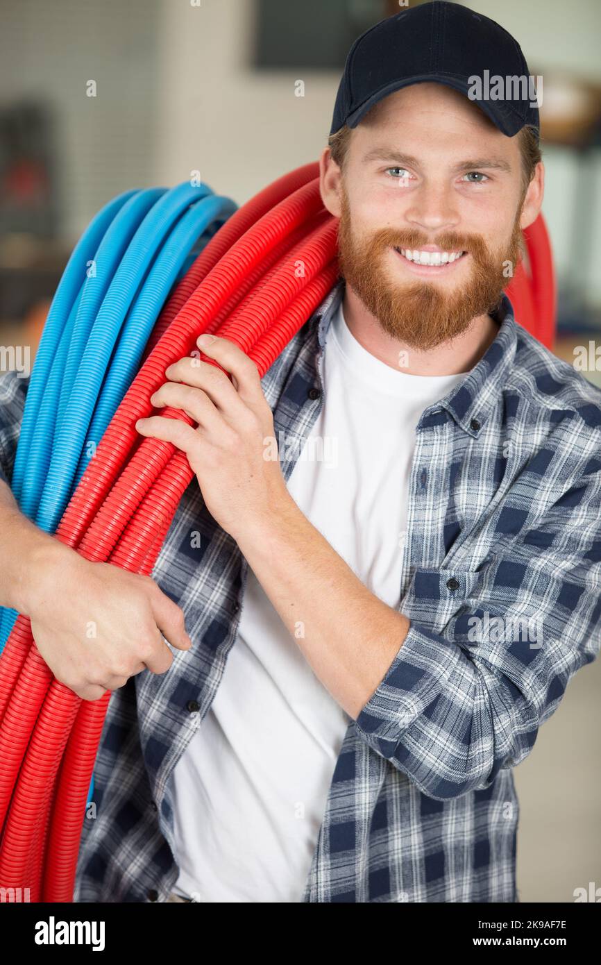 portrait of a smiling electrician at work Stock Photo - Alamy