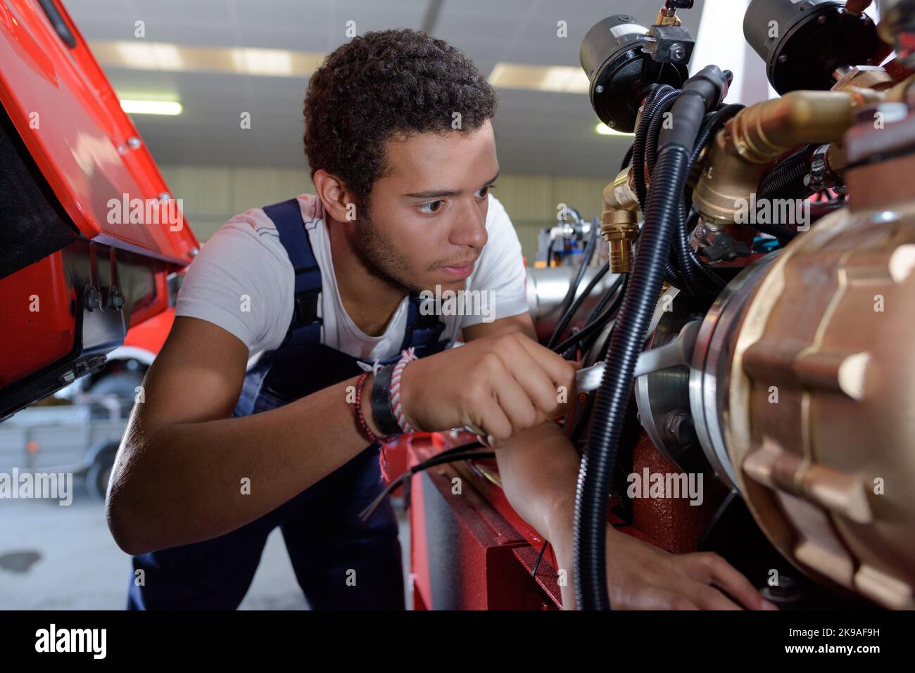 a man fixing automotive engine Stock Photo - Alamy