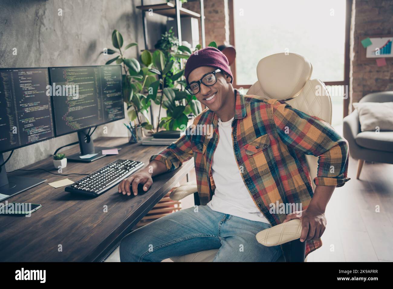 Portrait of positive intelligent handsome guy sitting chair toothy ...