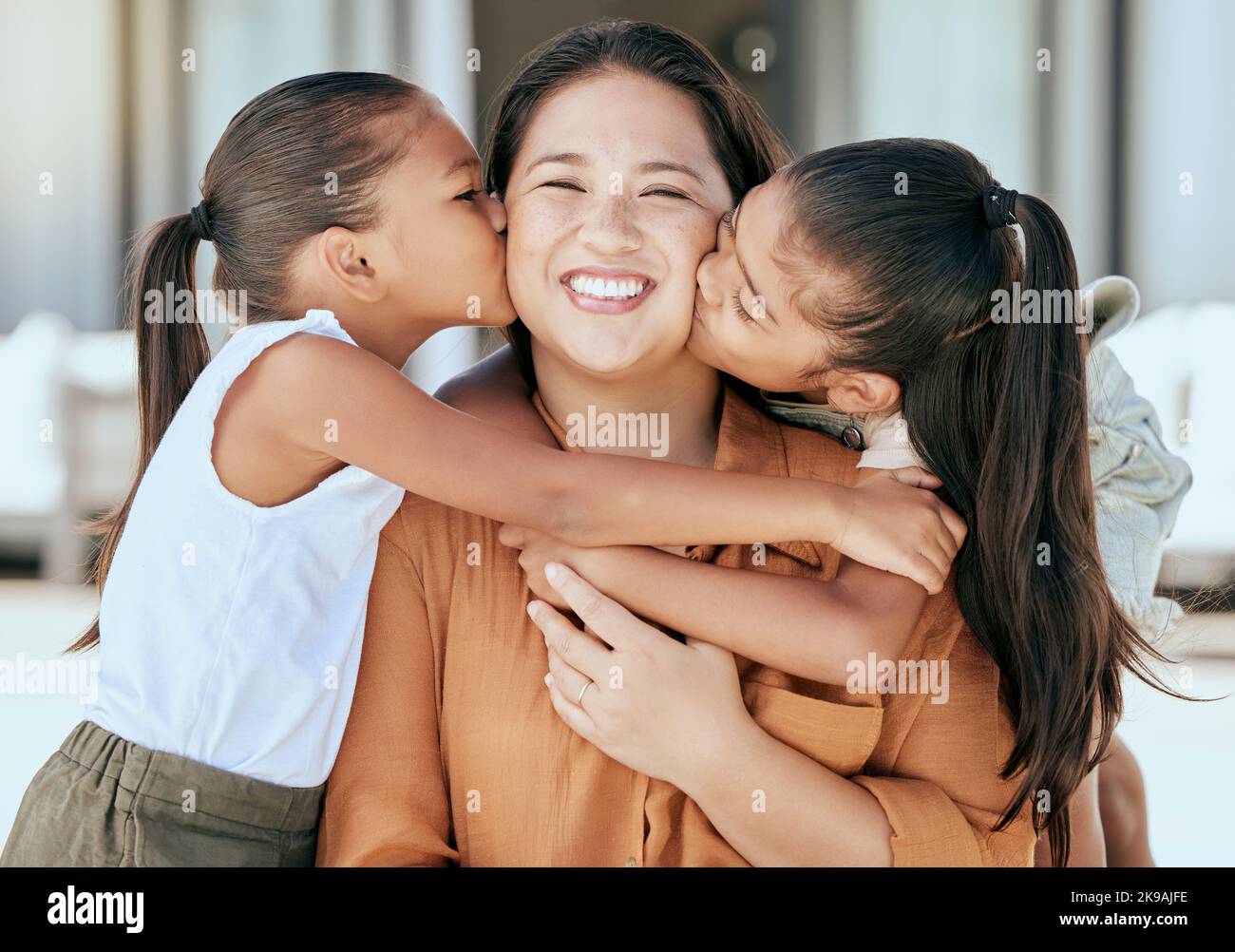 Love, mother and girls kiss, hug and happy together with smile and ...