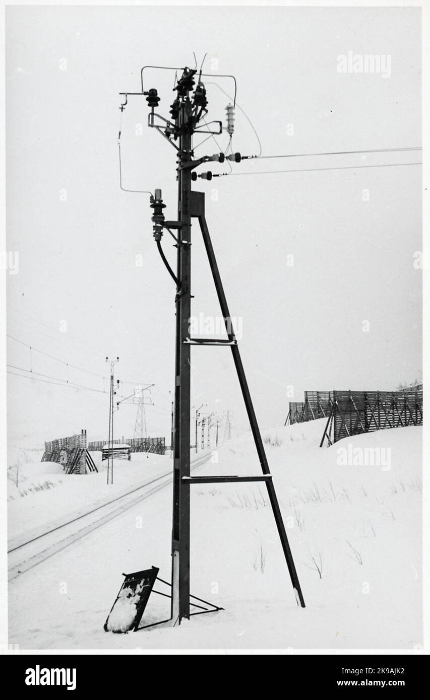 Power line post at the track Stock Photo - Alamy