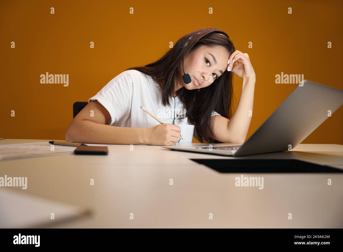 Beautiful Asian woman during the online job interview in room indoors ...