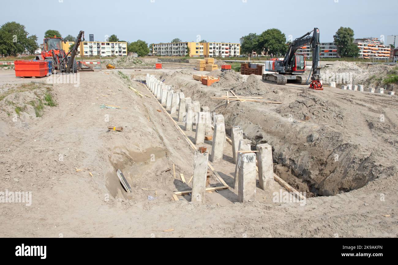 Concrete piles foundation for a new building on construction site ...