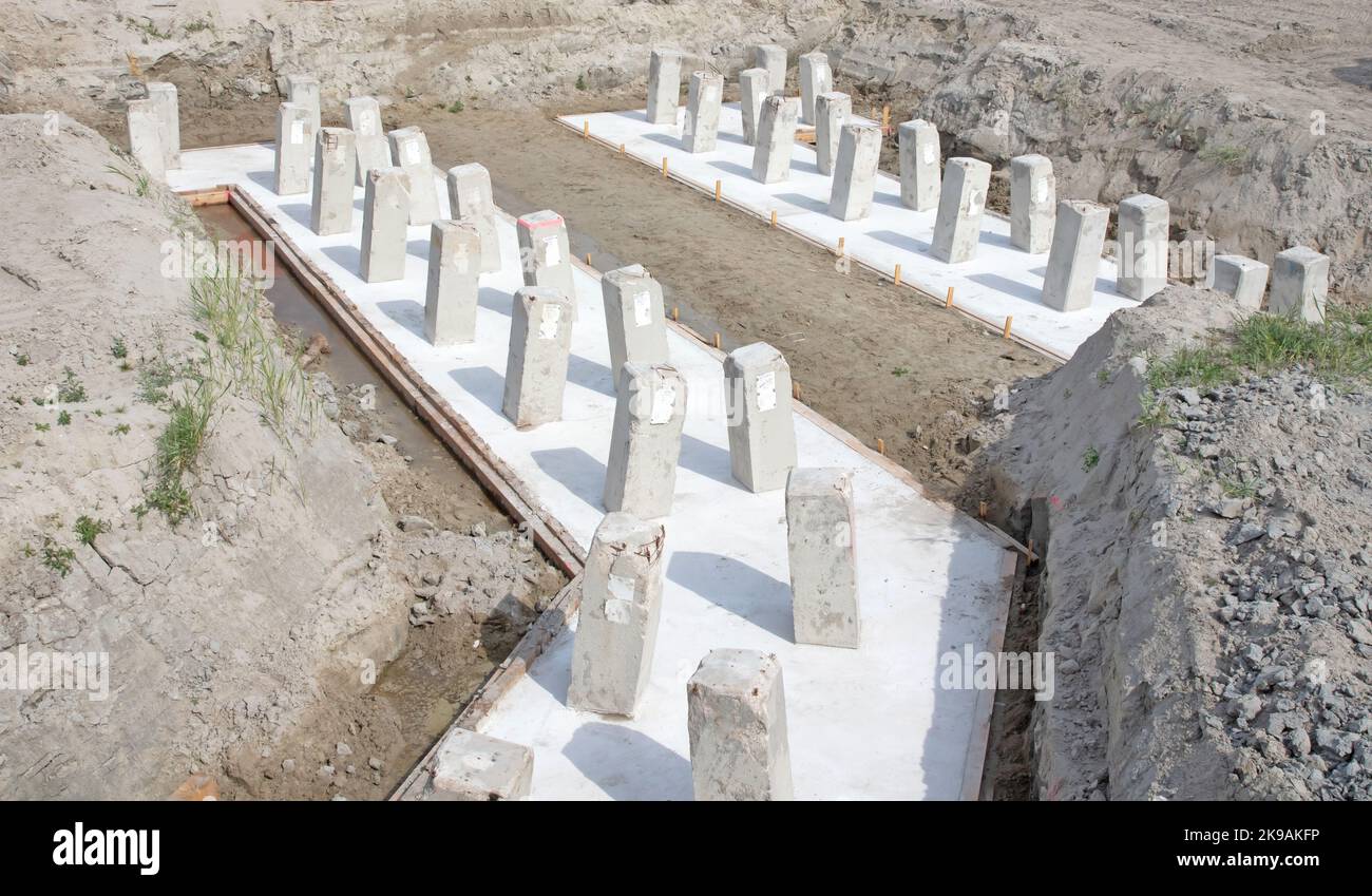 Concrete piles foundation for a new building on construction site ...