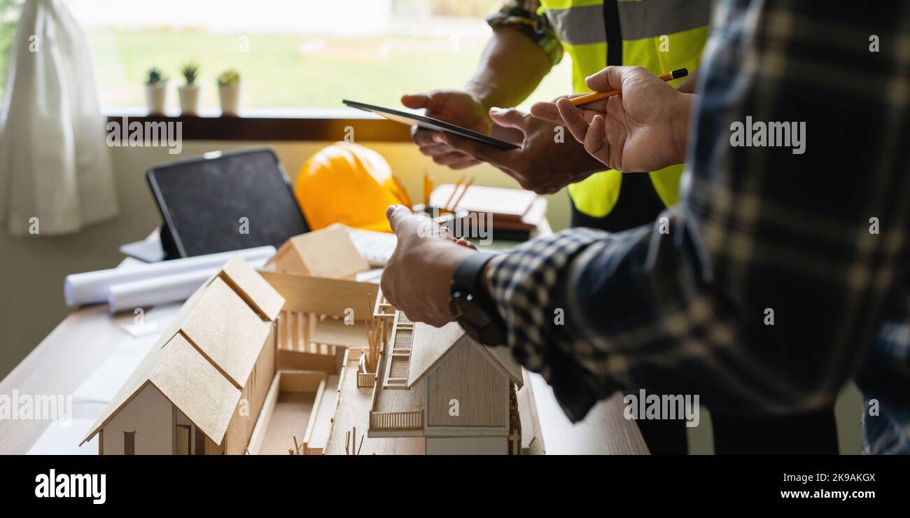 Architect man working with blueprints for architectural plan, engineer ...
