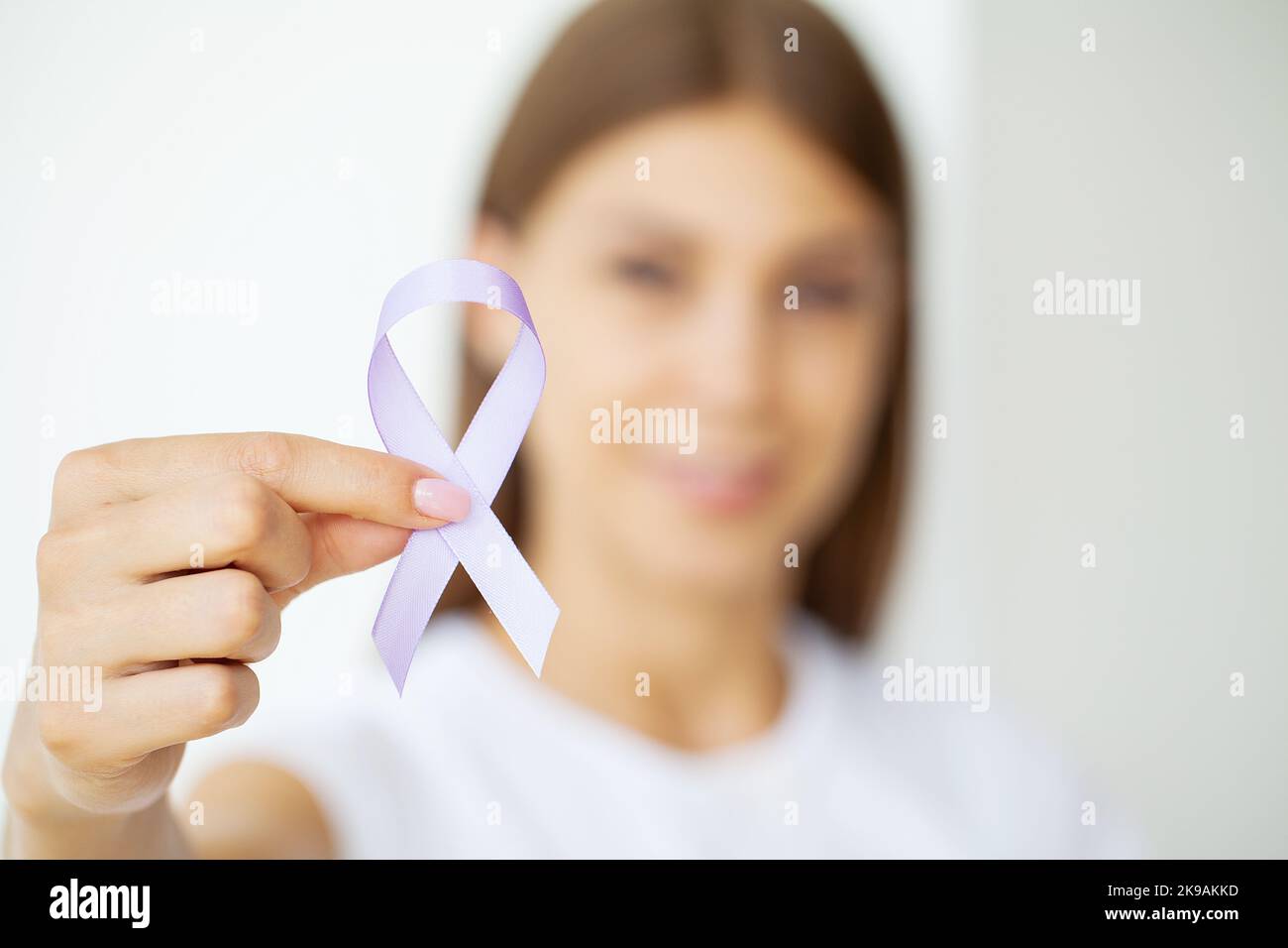 Woman holding purple ribbon, domestic violence awareness Stock Photo ...