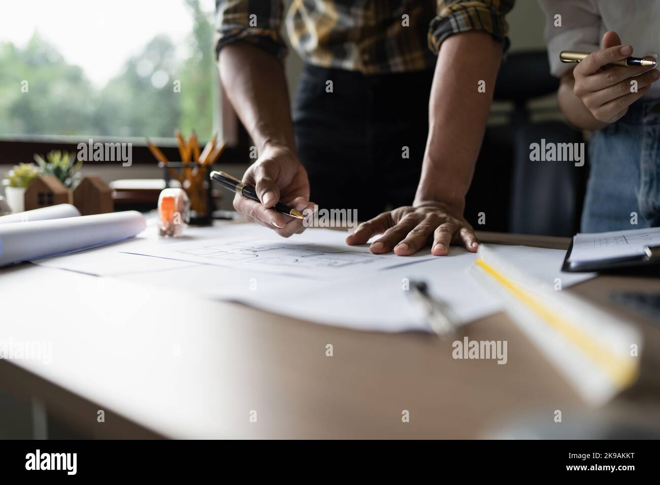 Architect man working with blueprints for architectural plan, engineer ...