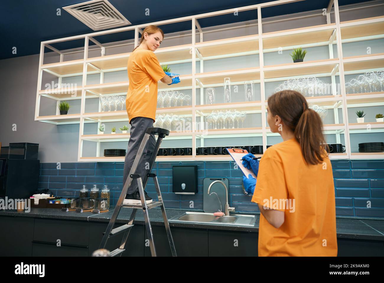 Cleaning company employees checking the list of cleaned areas Stock ...