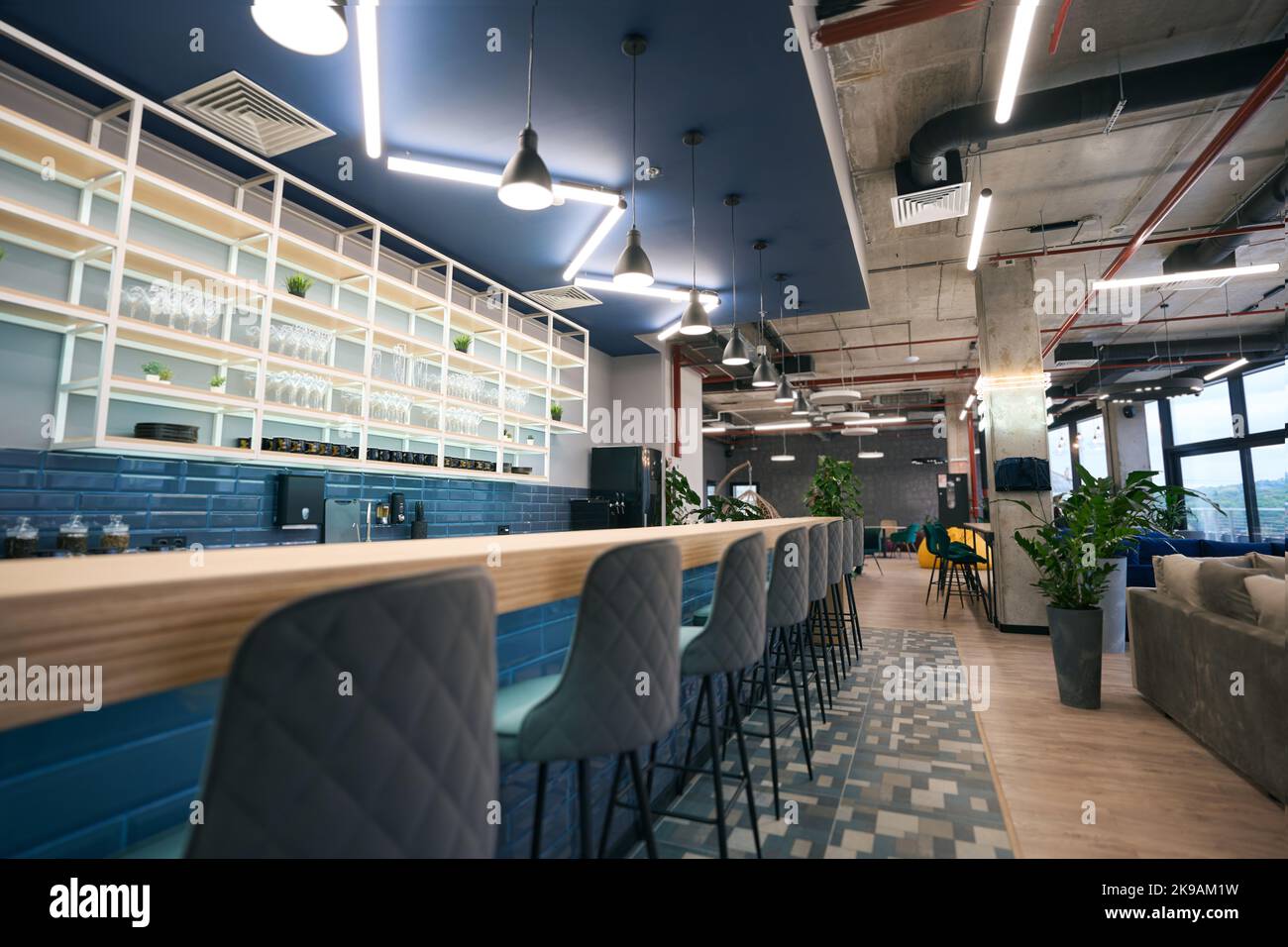 Creative zoning in a modern coworking space, stylish bar area Stock ...