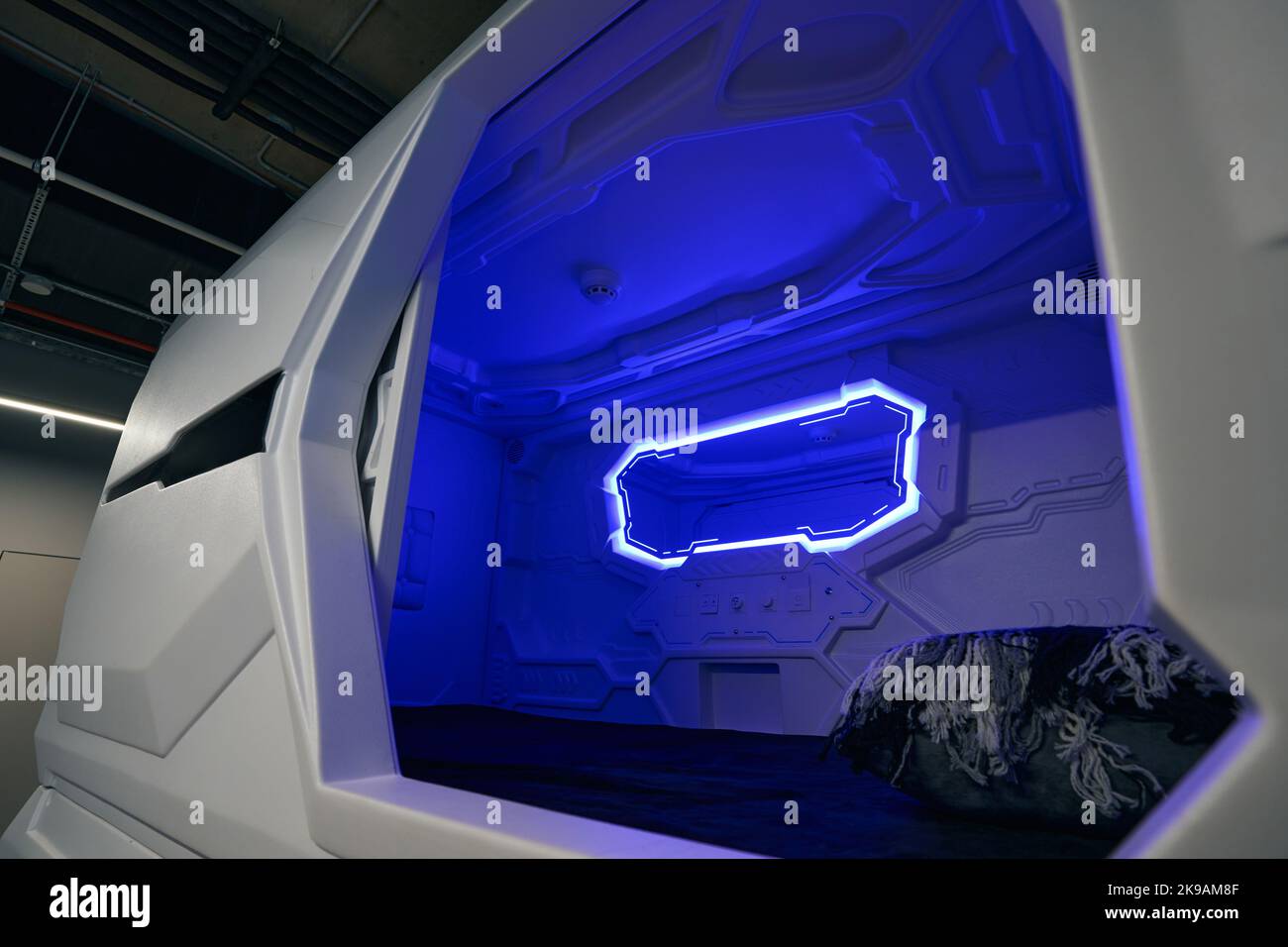Modern sleeping capsule, with relaxing blue lighting Stock Photo - Alamy