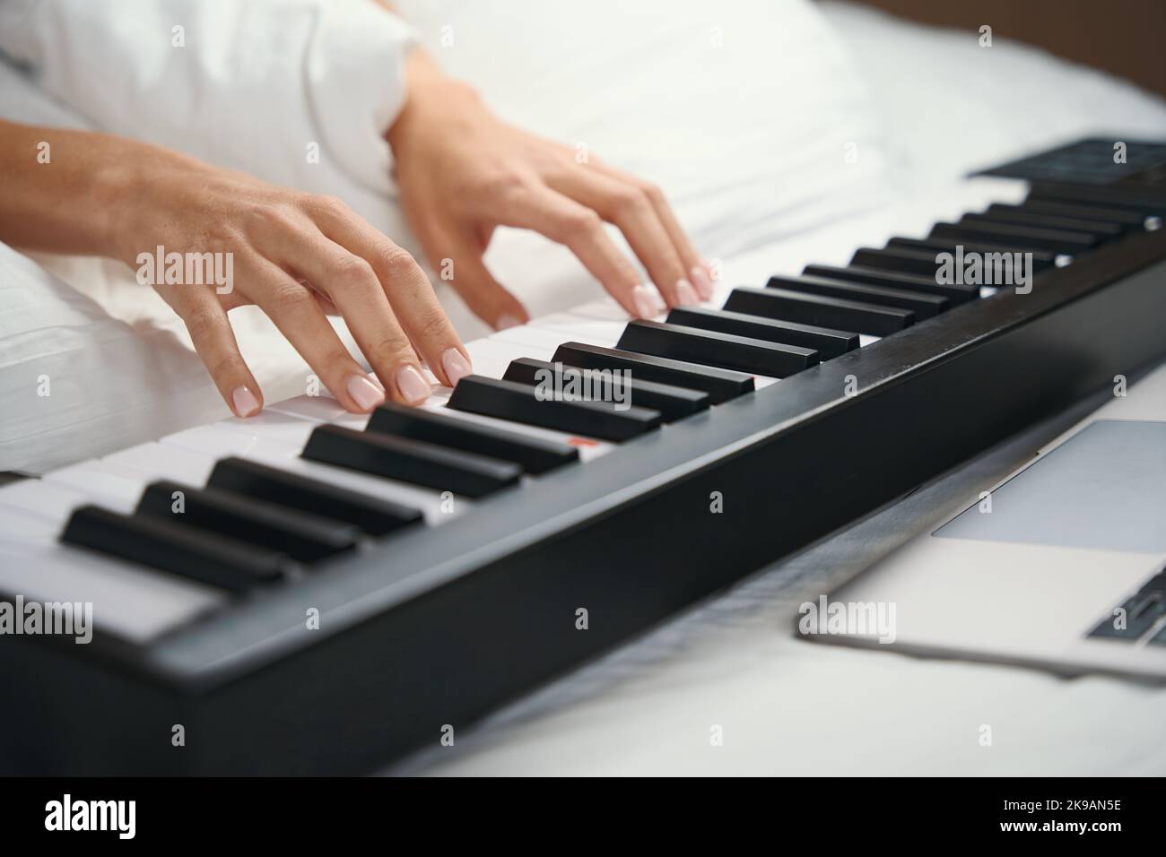 Woman playing piano alone hi-res stock photography and images - Alamy