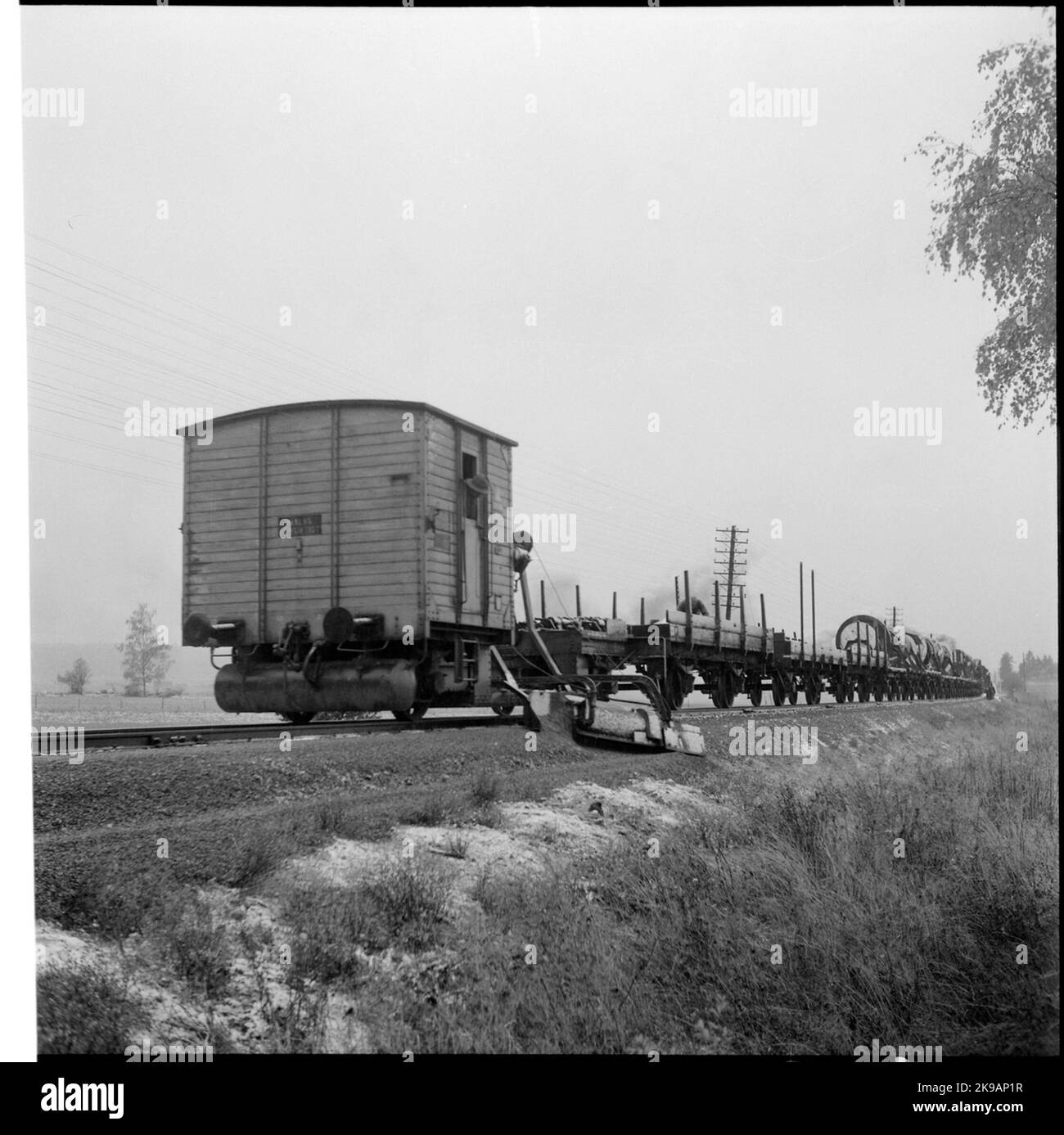 Cable output train. Plusing telecommunications in the embankment before ...