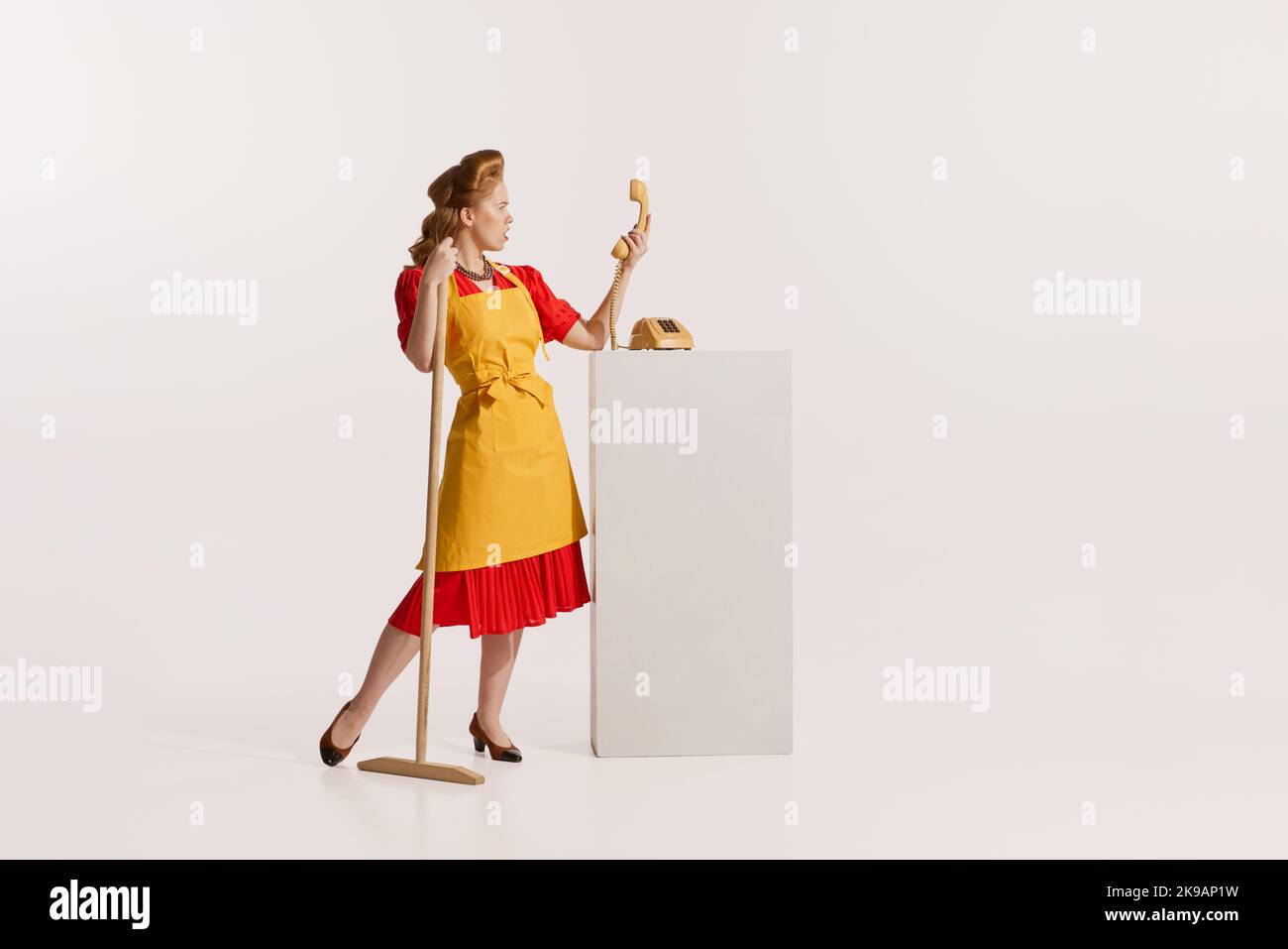 Portrait of elegant redhead woman with beautiful hairstyle cleaning ...