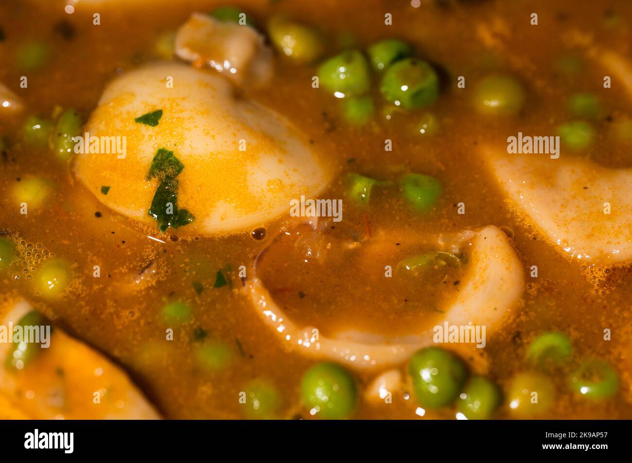 Pea and cuttlefish squid soup Stock Photo - Alamy