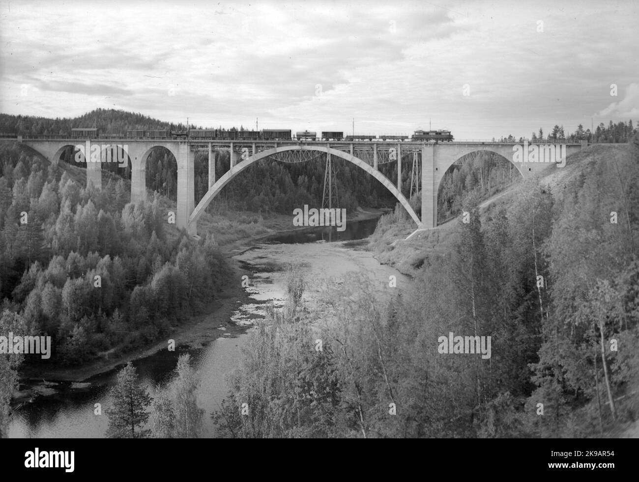 The State Railways, SJ M. Ellok with freight wagons pass the bridge ...