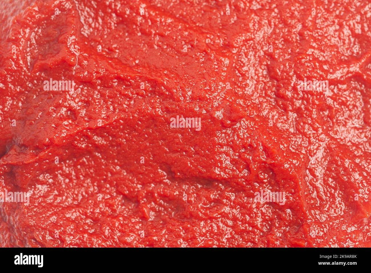 Tomato paste texture background close-up Stock Photo - Alamy
