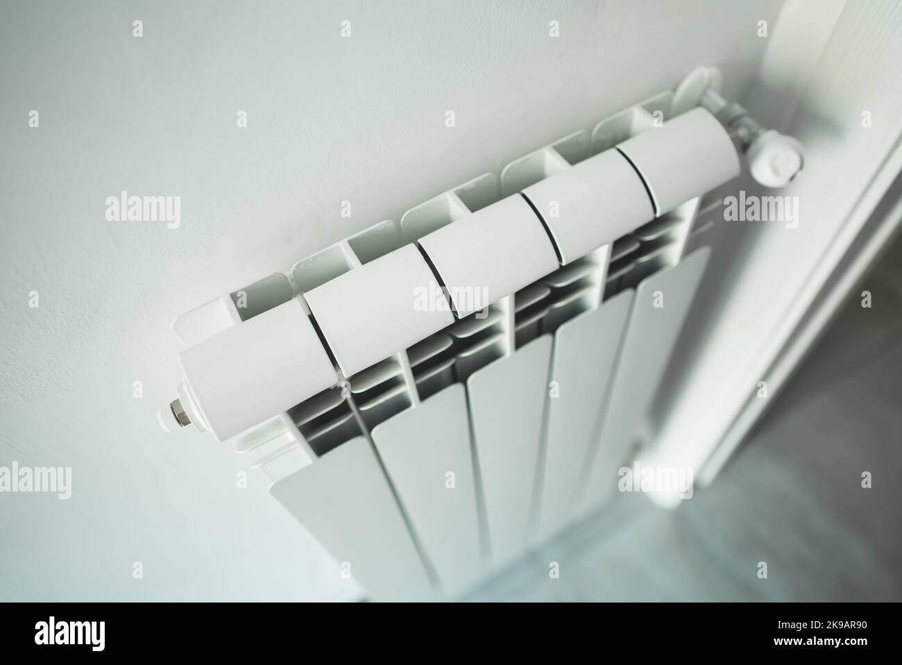 Metal radiator with adjustable valve inside the apartment Stock Photo ...