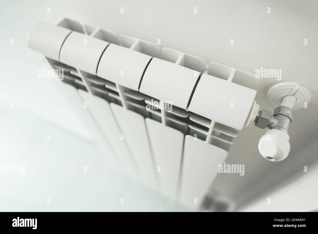 Metal radiator with adjustable valve inside the apartment Stock Photo ...