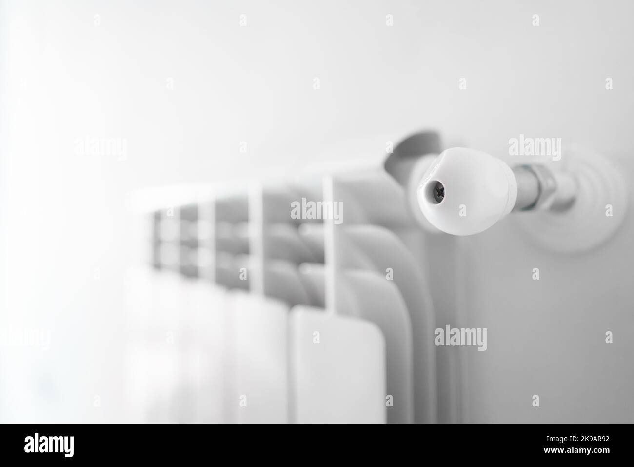 Metal radiator with adjustable valve inside the apartment Stock Photo ...