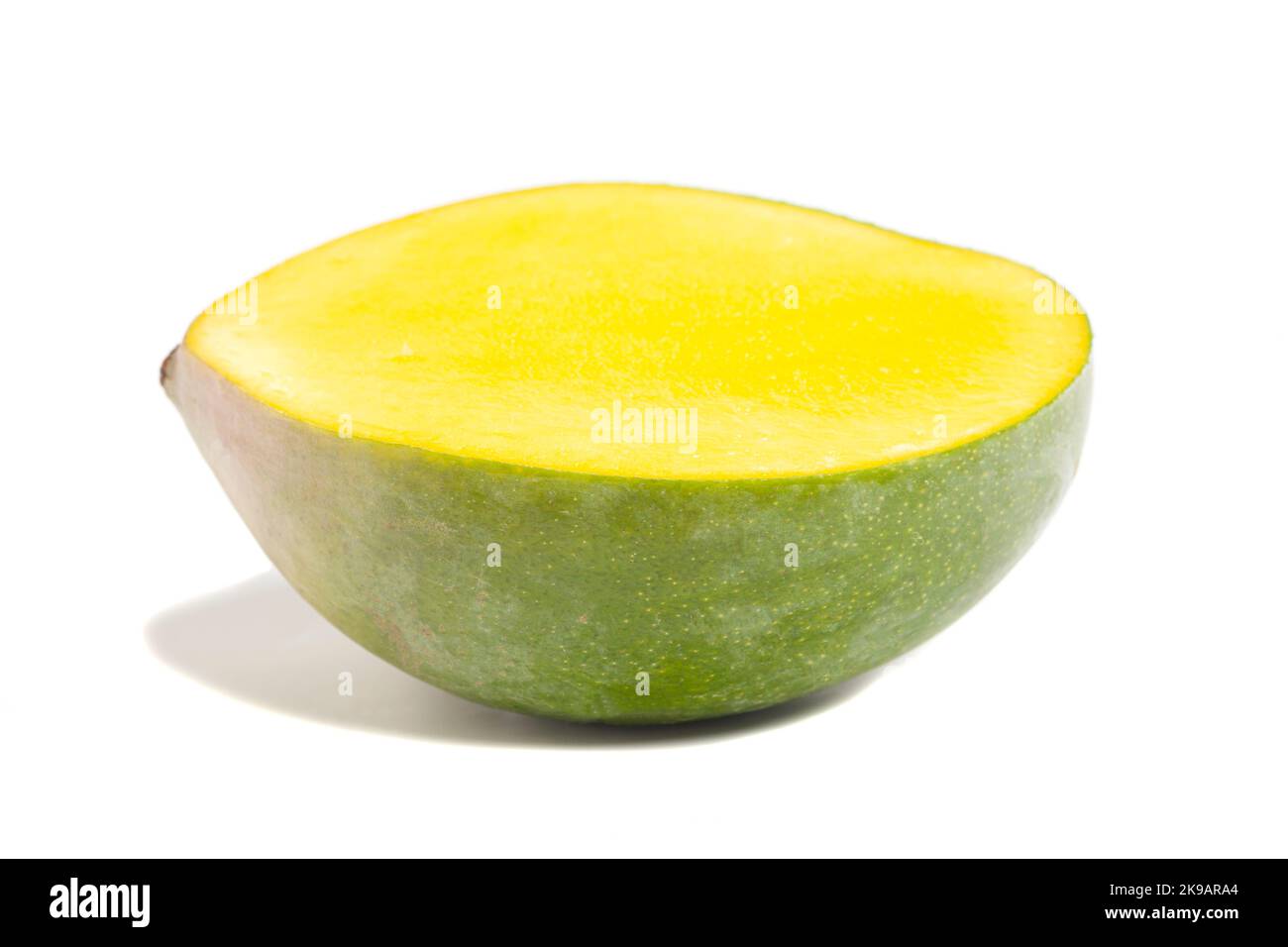 chopped half of ripe mango fruit isolated on white background Stock ...