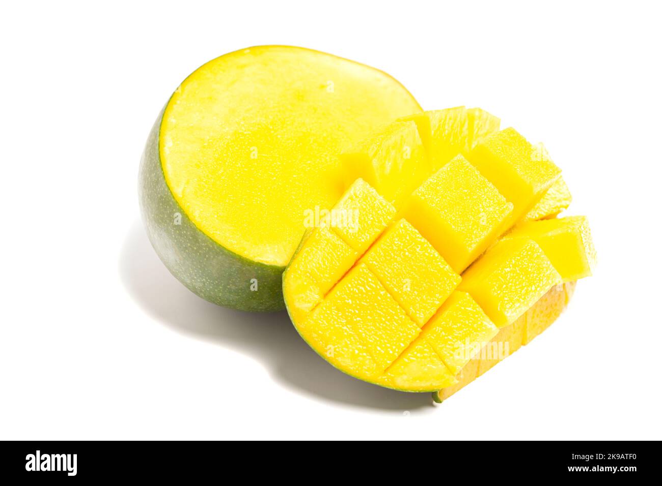 chopped half of ripe mango fruit isolated on white background Stock ...