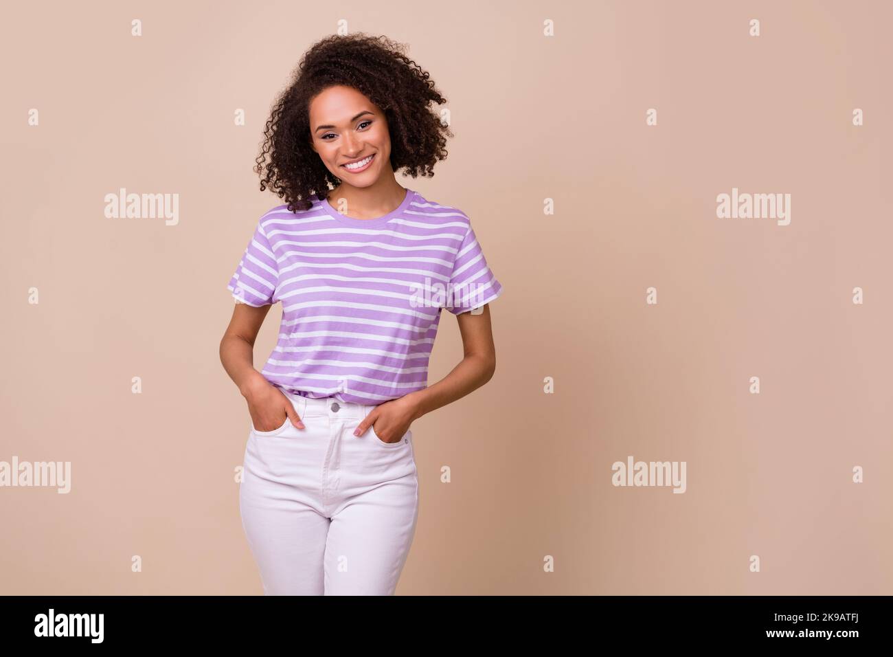 Portrait photo of young attractive nice woman wear striped t-shirt put ...