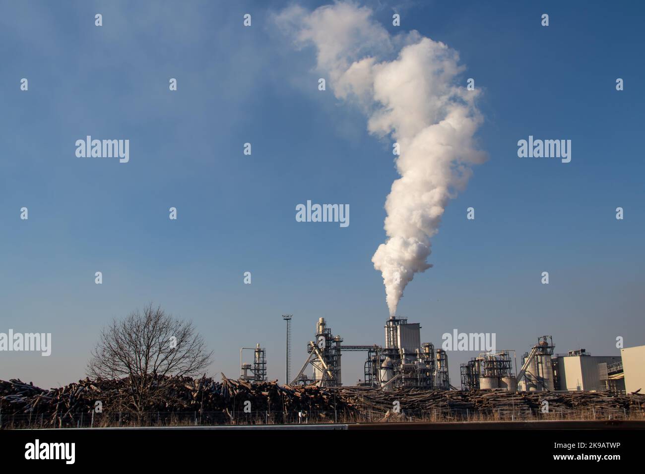 City pollution mixed with morning fog, industrial chimneys around ...