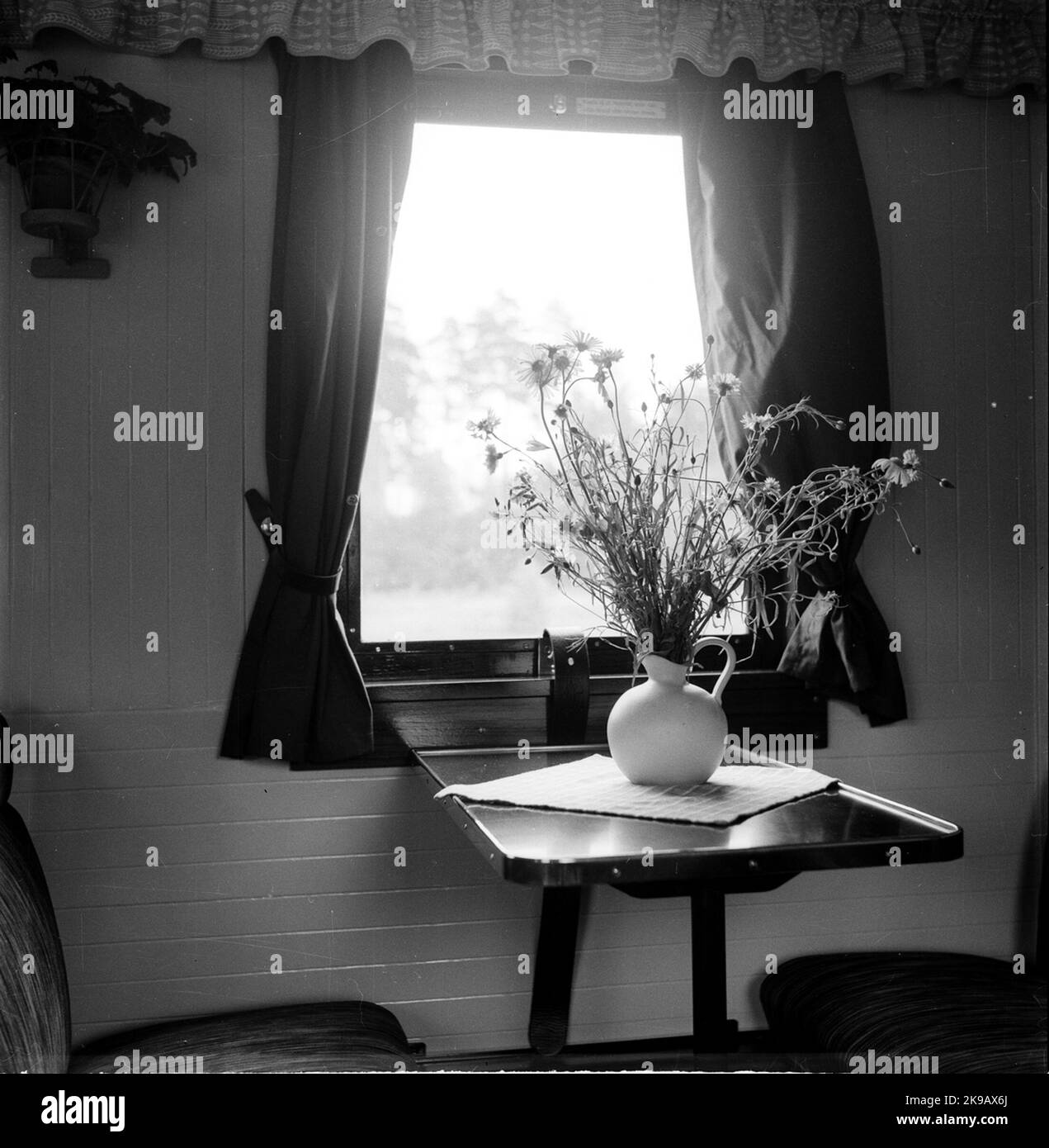State Railways, SJ Train Home. Flowers in vase on table in the ...
