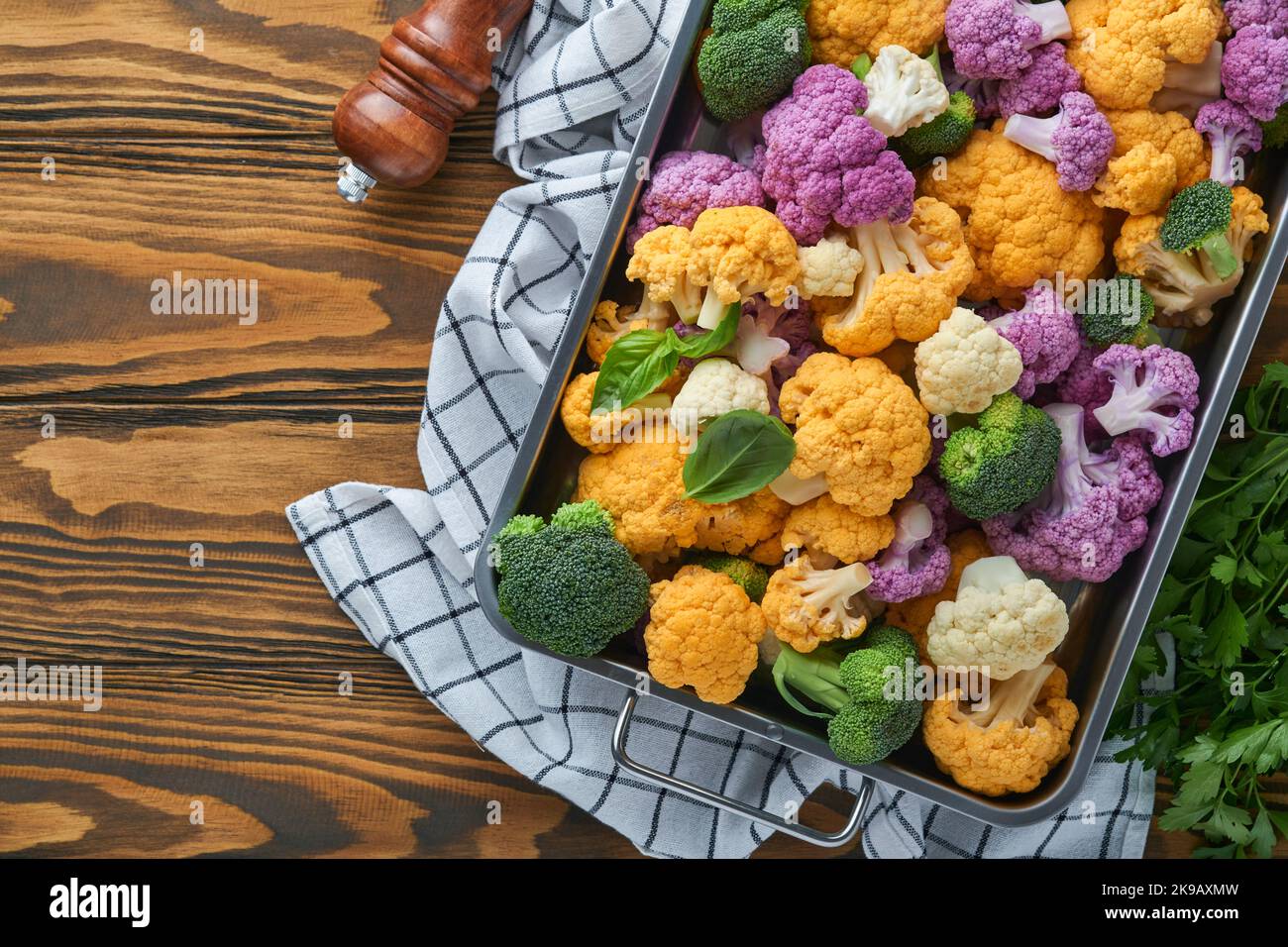 Colorful cauliflower. Cauliflower cut into small pieces in iron pan on ...