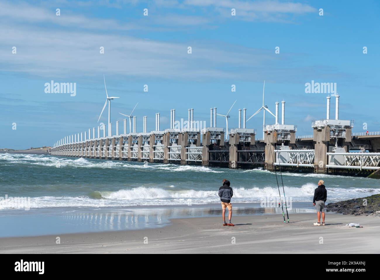 Anglers at Banjaard Beach in front of the Oosterschelde barrier ...