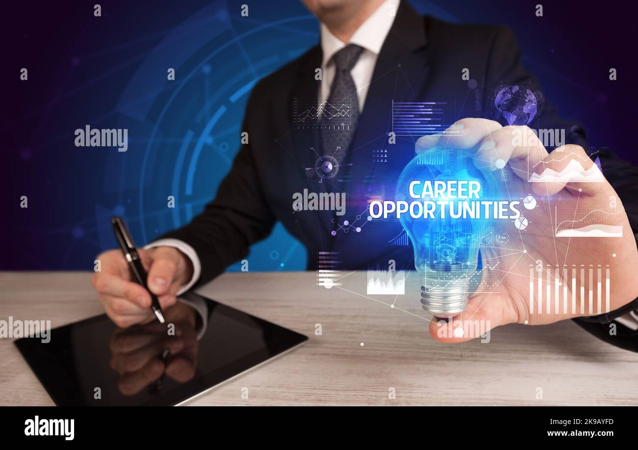 Businessman holding a light bulb, new business concept Stock Photo - Alamy