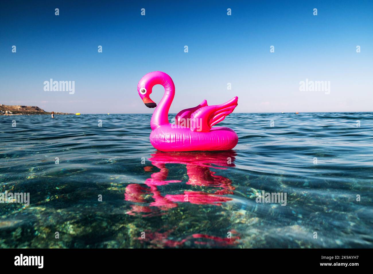 pink flamingo inflatable on the water of sea Stock Photo - Alamy