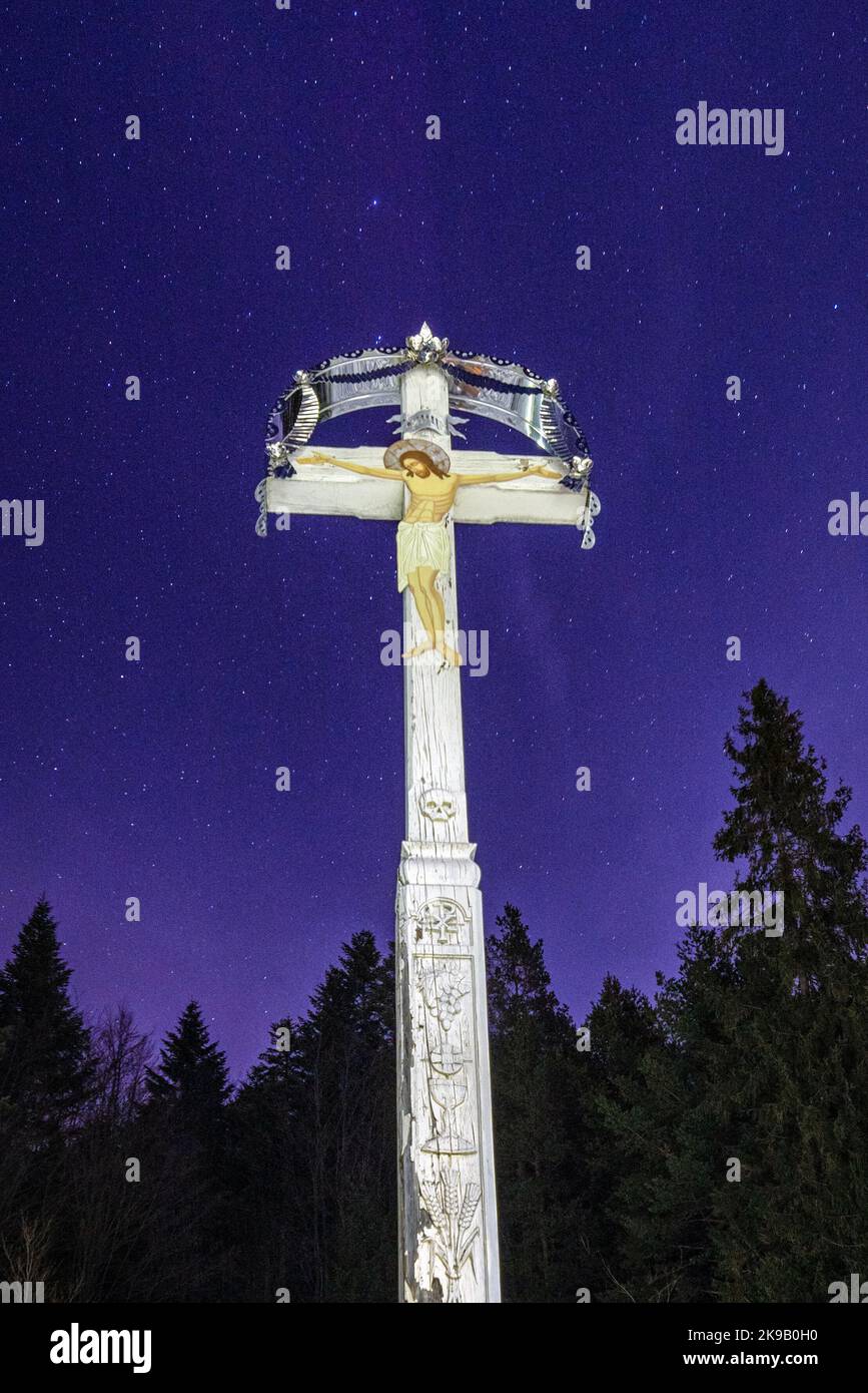 Jesus Christ on a cross. Dark sky with star at background. Catholic ...