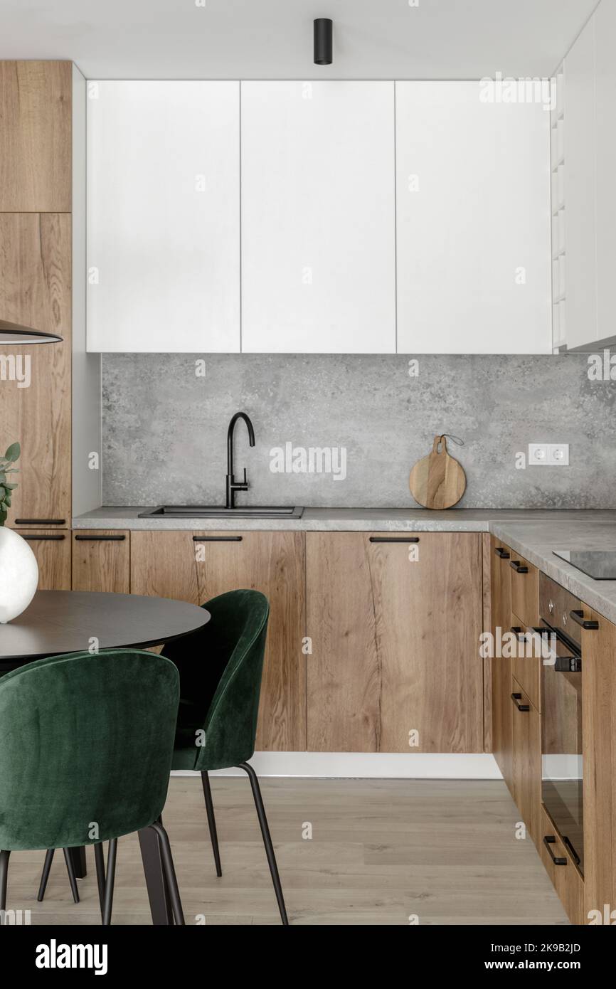 Modern minimalistic kitchen and dining room interior with wooden and ...