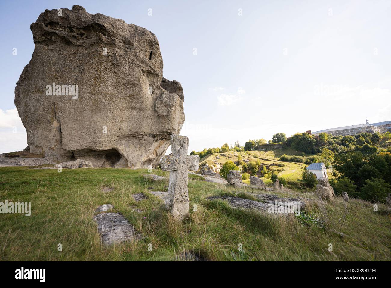Pidkamin inselberg stone on hill and ancient graveyard. Ukraine Stock ...