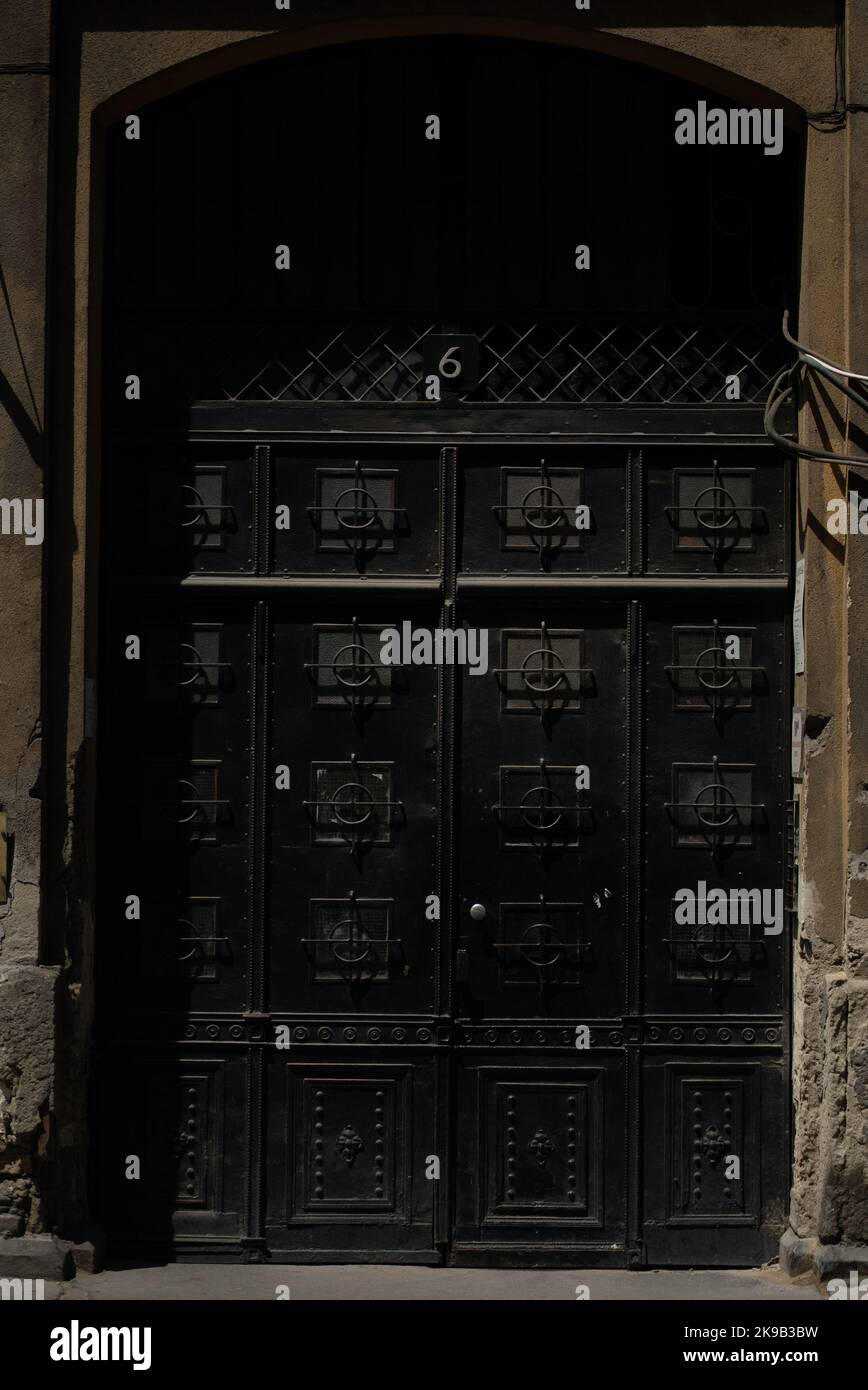 Fancy old entry front door with small designed windows Stock Photo - Alamy