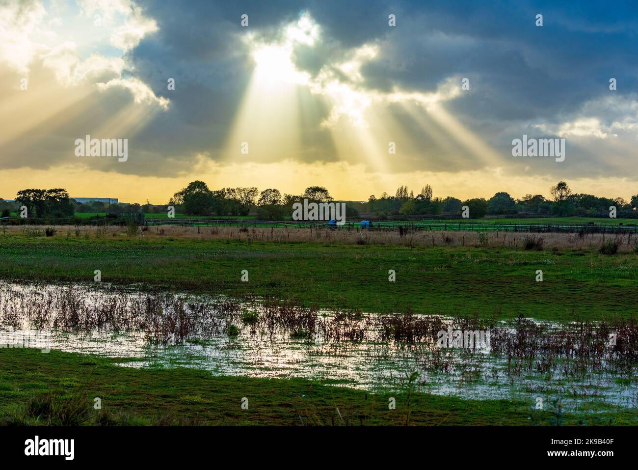 Dramatic skies with sun rays breaking through showing the end of the ...