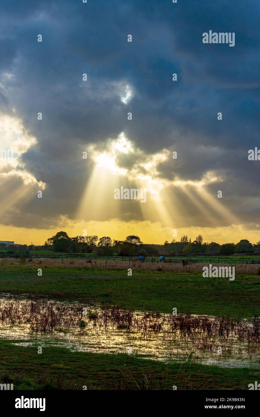 Dramatic skies with sun rays breaking through showing the end of the ...