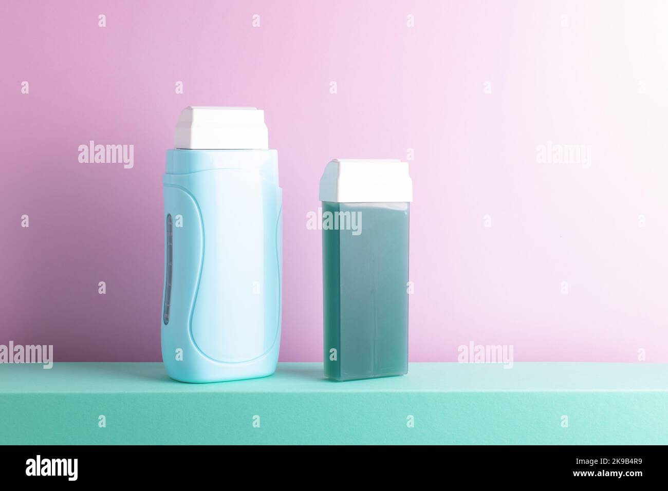 Hair removal equipment standing on green podium against purple ...