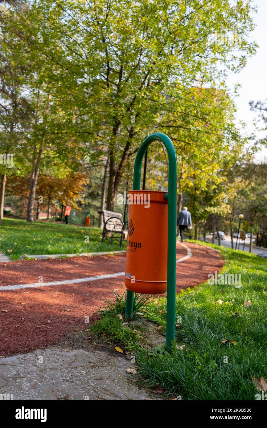 Park and dustbin in autumn Stock Photo - Alamy