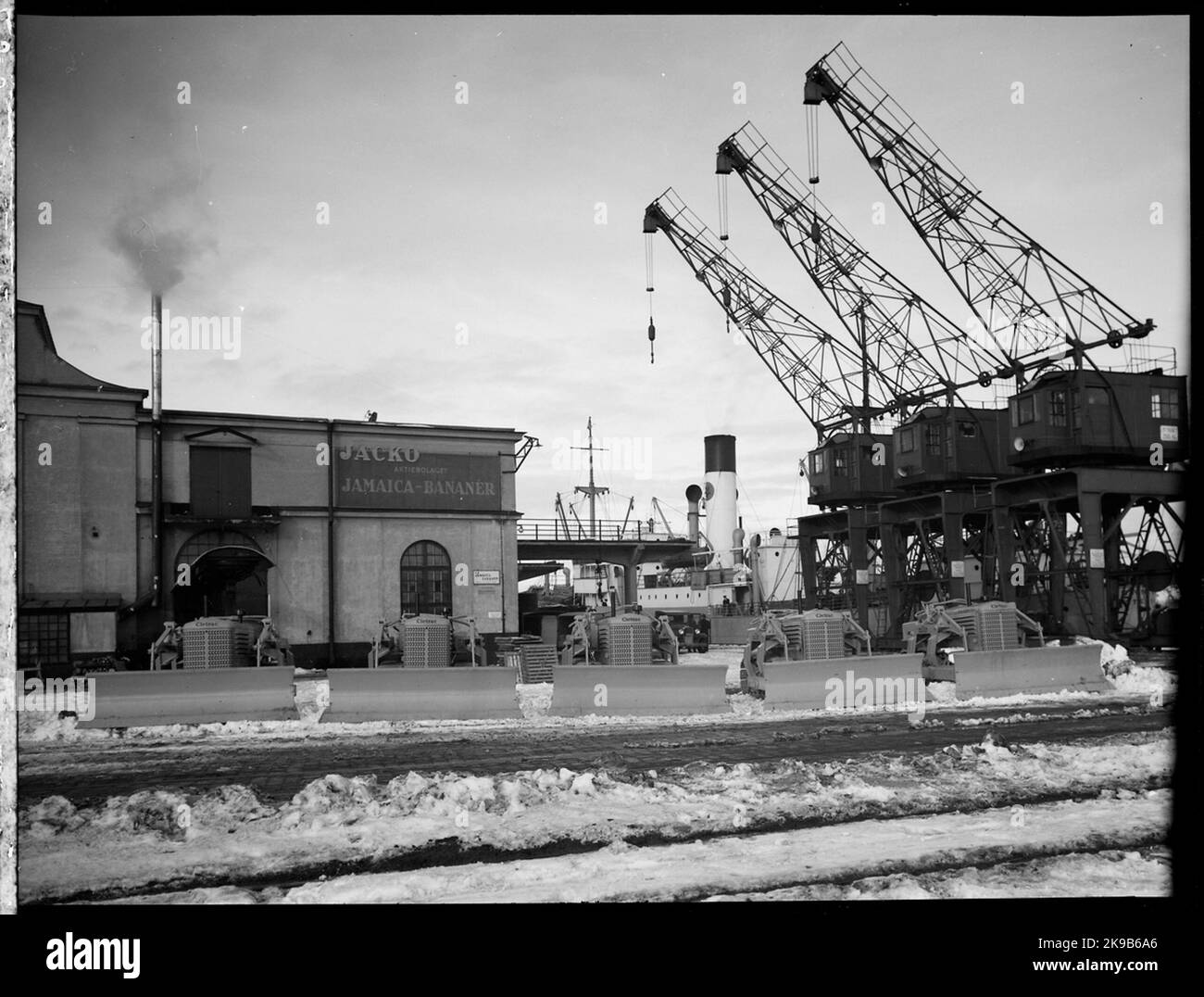 Port station with ships and cranes. Cletrac Bulldozer (shaft machine ...