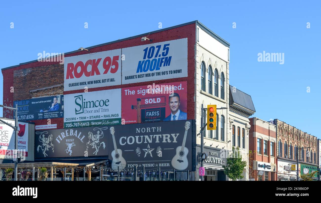 Advertisement billboards in the exterior wall of a building in Dunlop ...