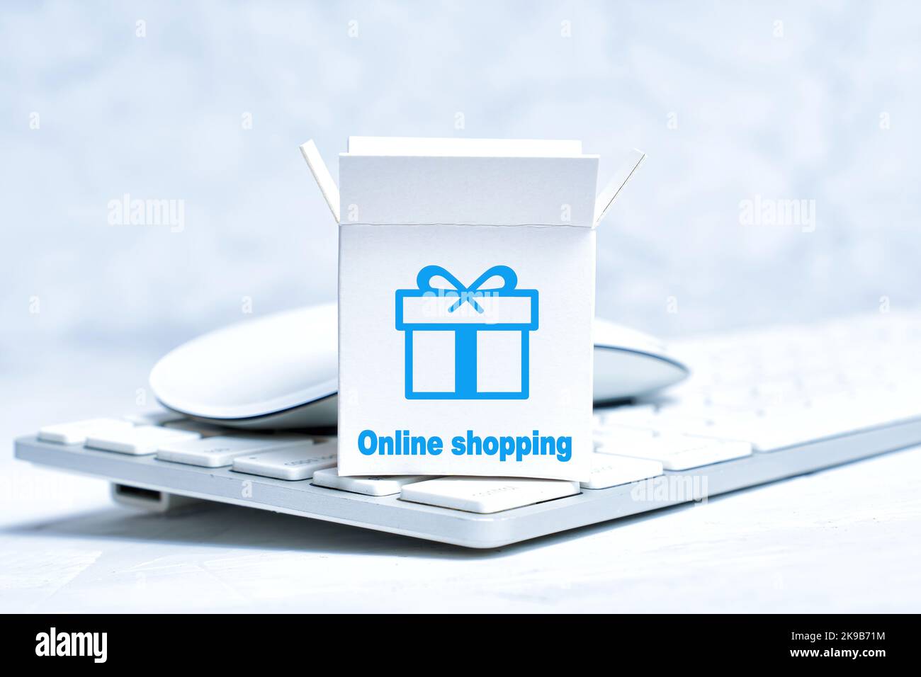 Keyboard, mouse and tiny gift box. Buying peripherals online Stock ...