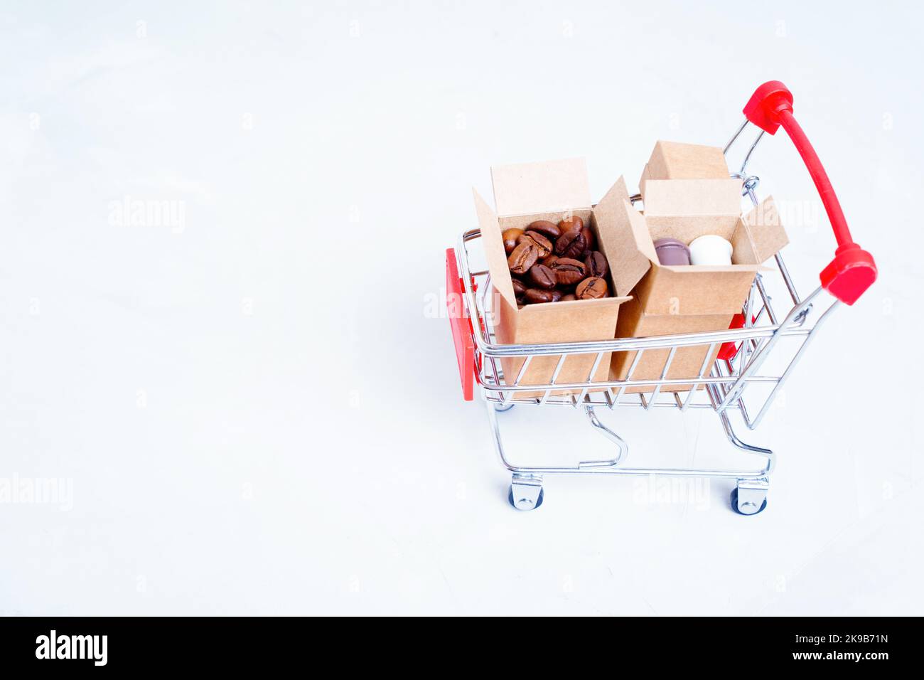 Small cardboard boxes full of roasted coffee beans and paper coffee ...