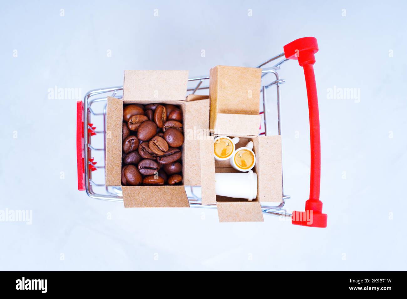 Top view of a push trolley loaded with shipping boxes with roasted ...