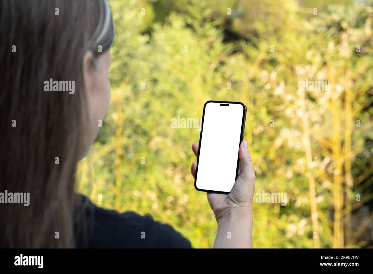 Happy woman wave hand, over shoulder view of Caucasian blonde happy ...