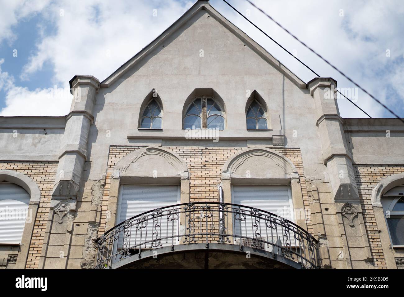 Fancy old designed building with an elegant balcony Stock Photo - Alamy
