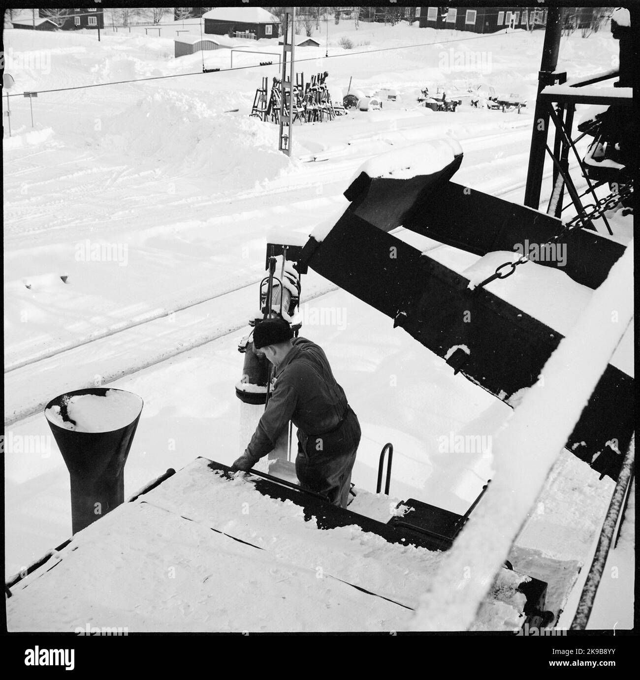 Holger Johnsson replenishes water and coal Stock Photo - Alamy