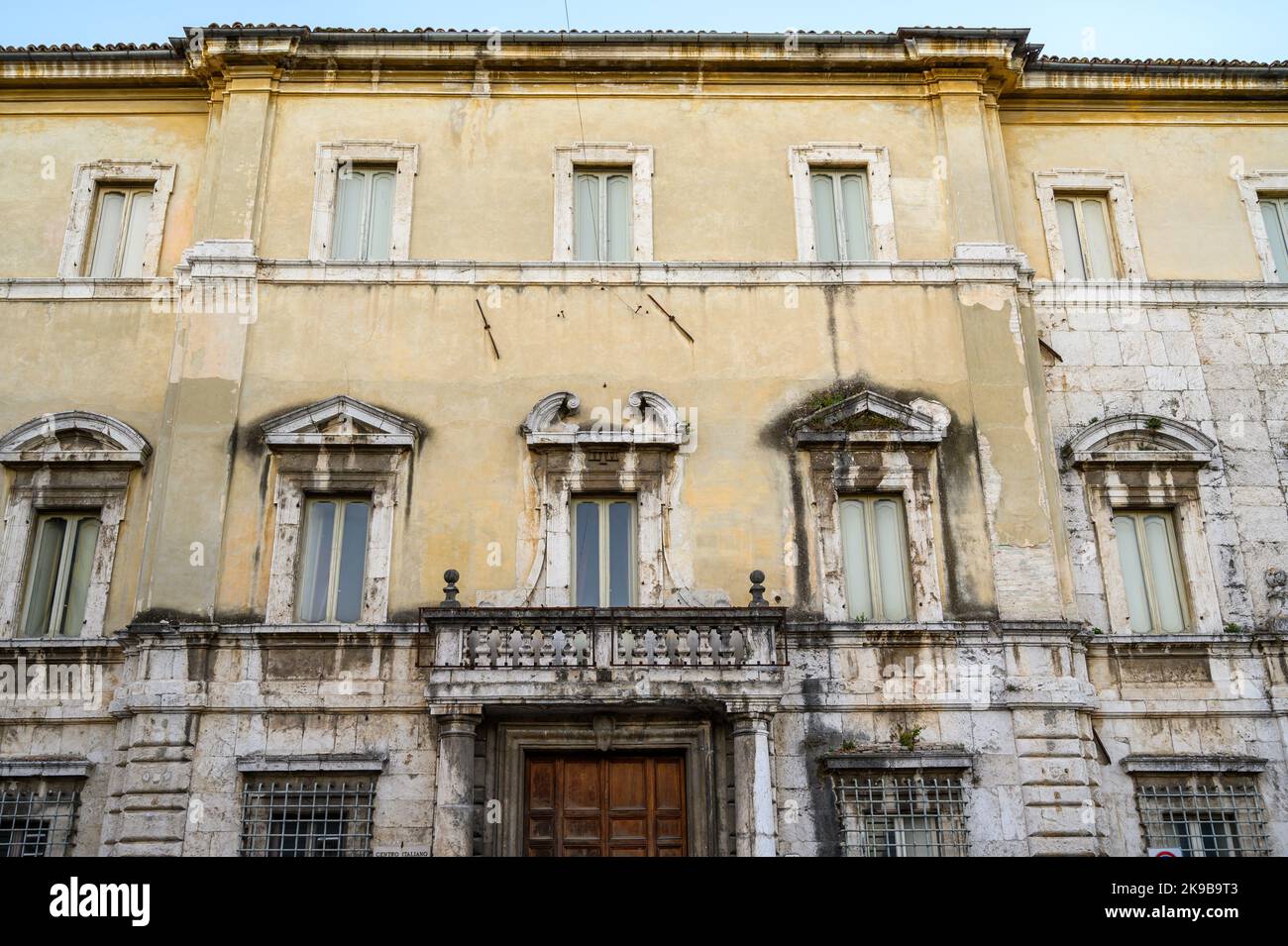 Details of front facade of a run-down, old and grand house on Freedom ...